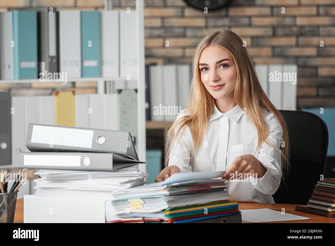Woman stack papers on table hi-res stock photography and images - Alamy