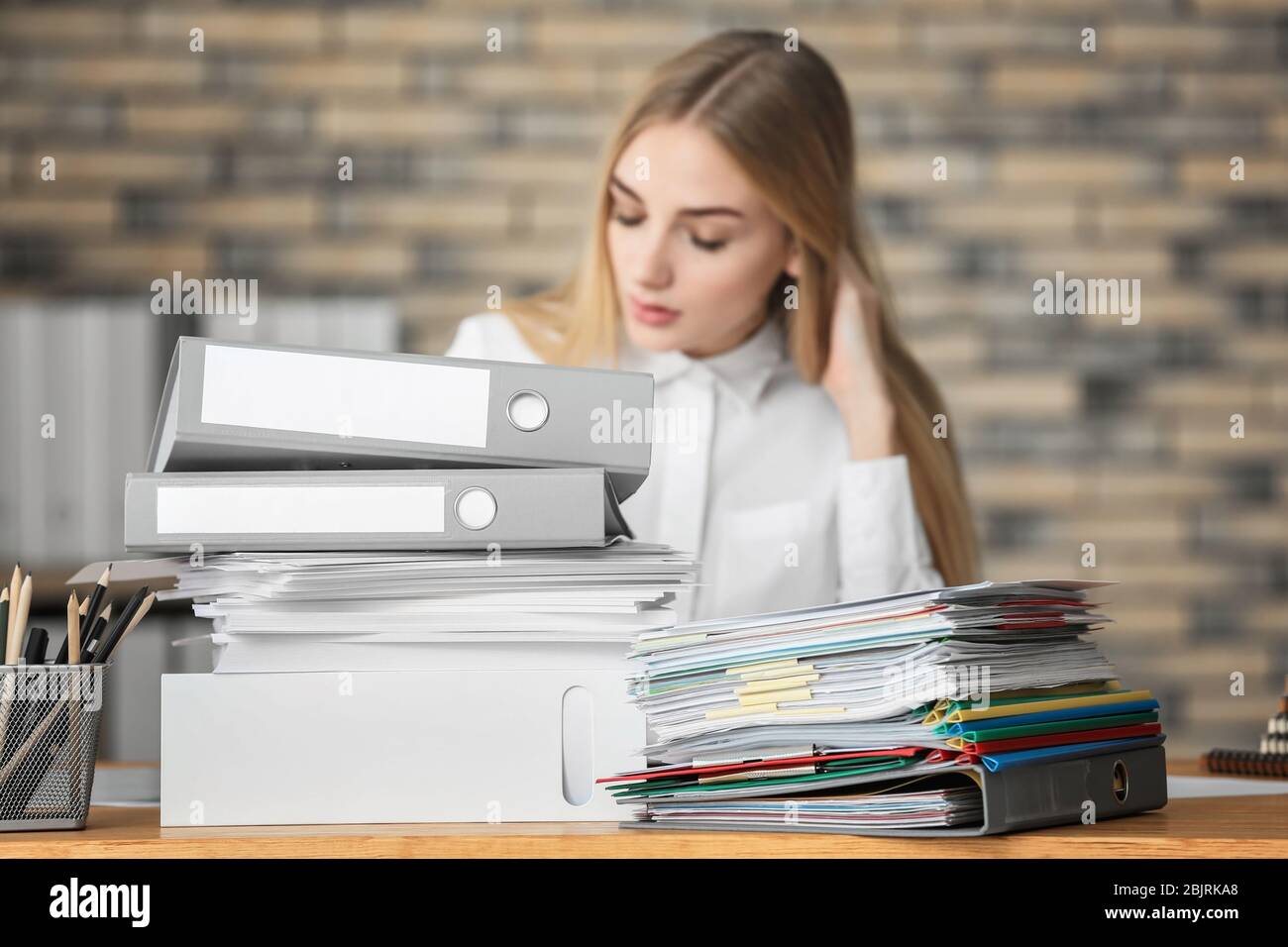 Woman stack papers on table hi-res stock photography and images - Alamy