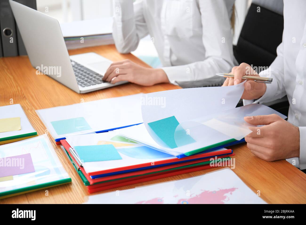 Young employees working documents hi-res stock photography and images ...