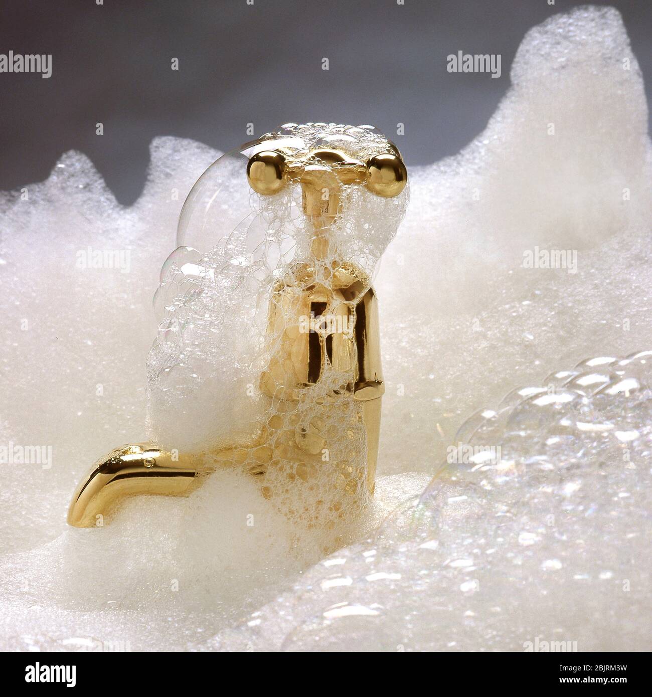 Water Tap covered in soap suds Stock Photo - Alamy