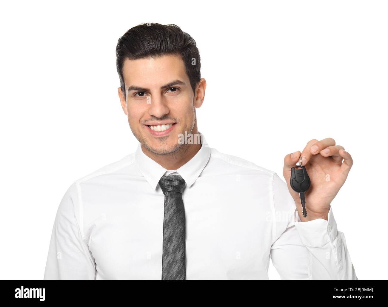 Salesman in formal clothes holding car key on white background Stock ...