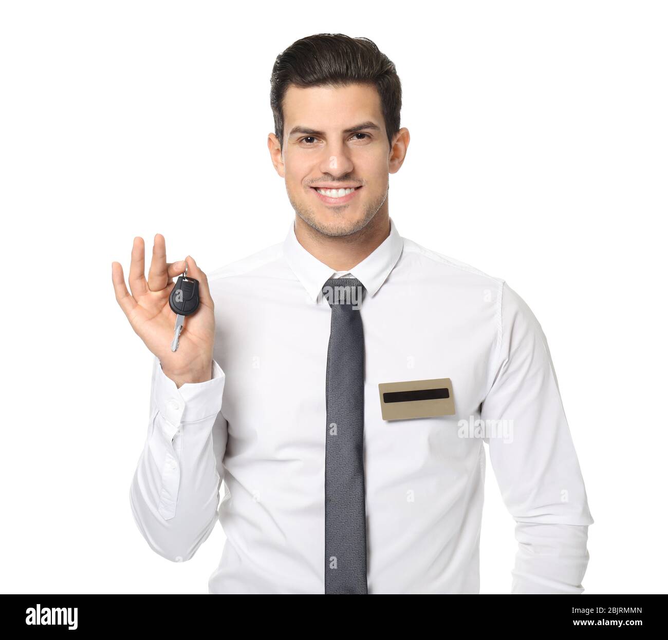 Salesman in formal clothes holding car key on white background Stock ...