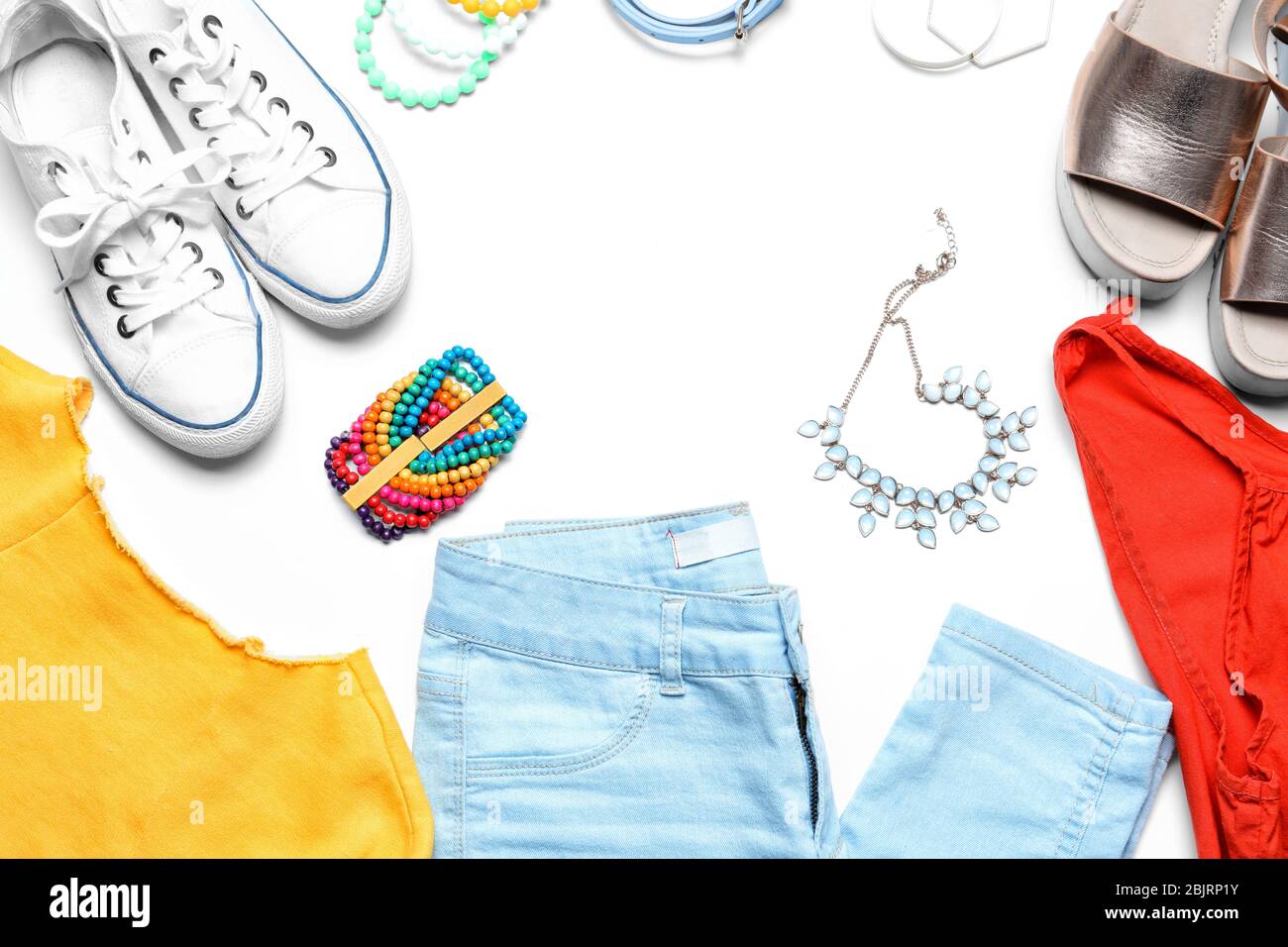 Stylish set of casual female clothes on white background Stock Photo ...