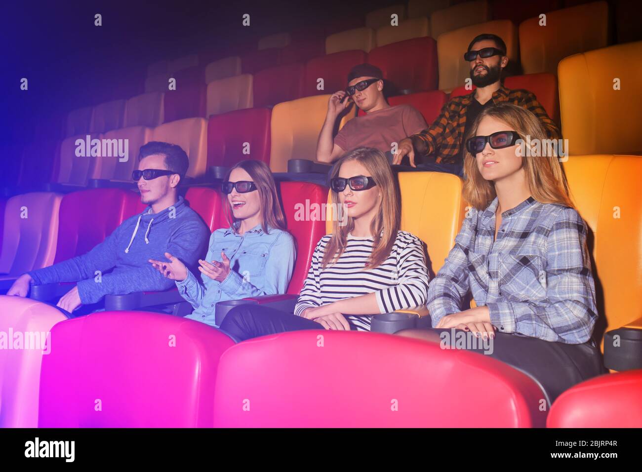 Young people watching movie hi-res stock photography and images - Alamy