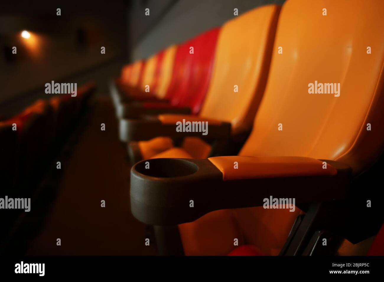 Empty cinema with comfortable chairs, closeup Stock Photo - Alamy