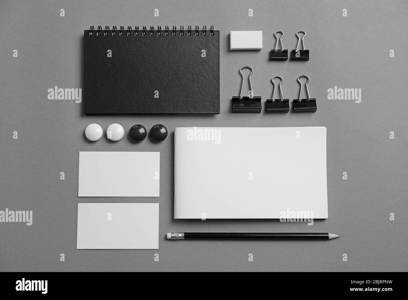 Blank items as mockups for branding on grey background Stock Photo - Alamy