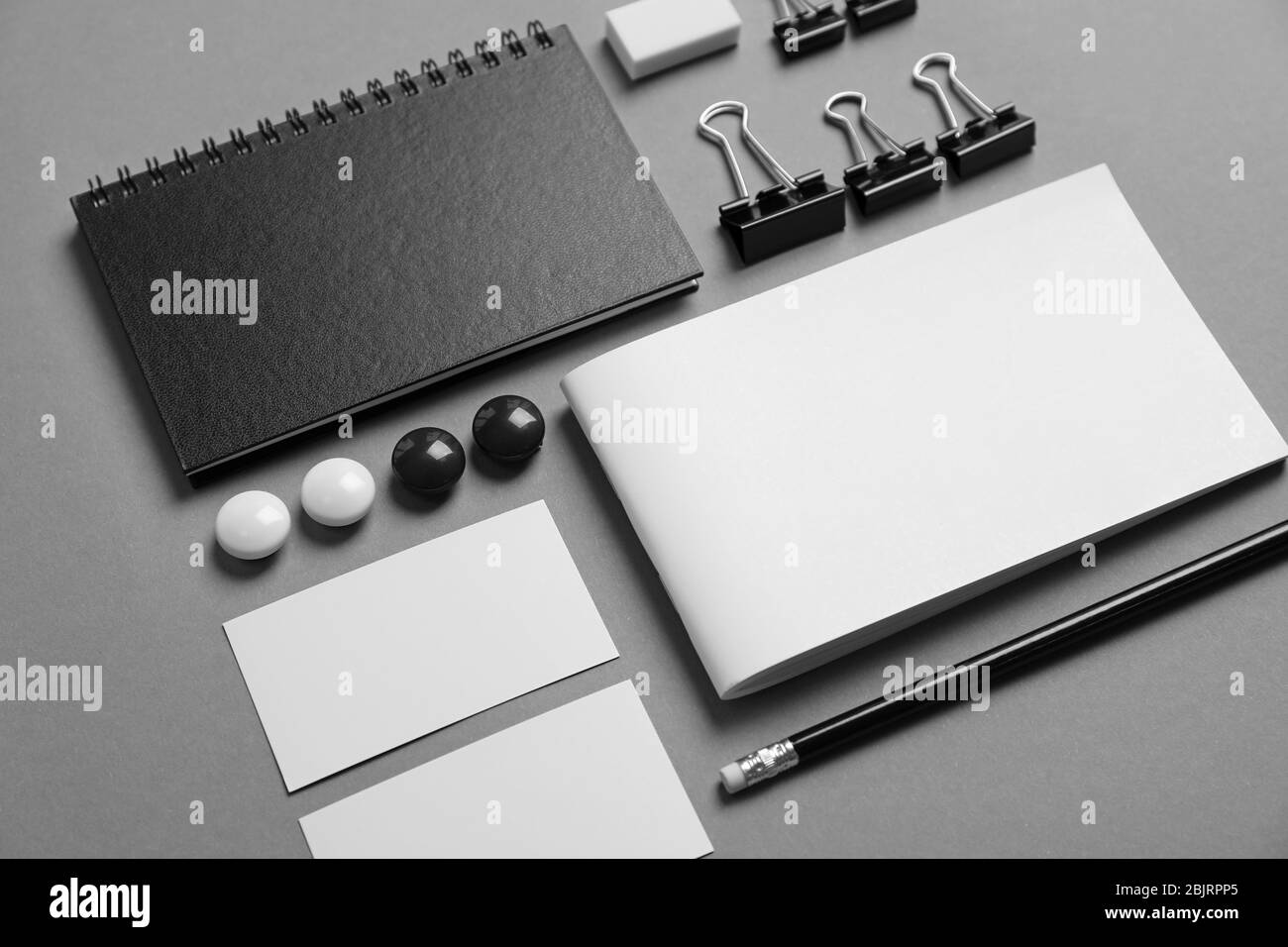 Blank items as mockups for branding on grey background Stock Photo - Alamy