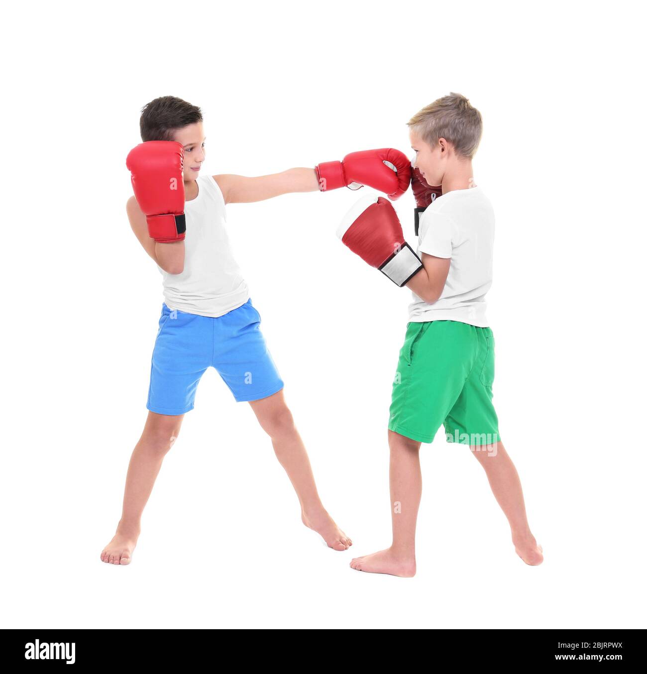 Cute little boys boxing on white background Stock Photo - Alamy