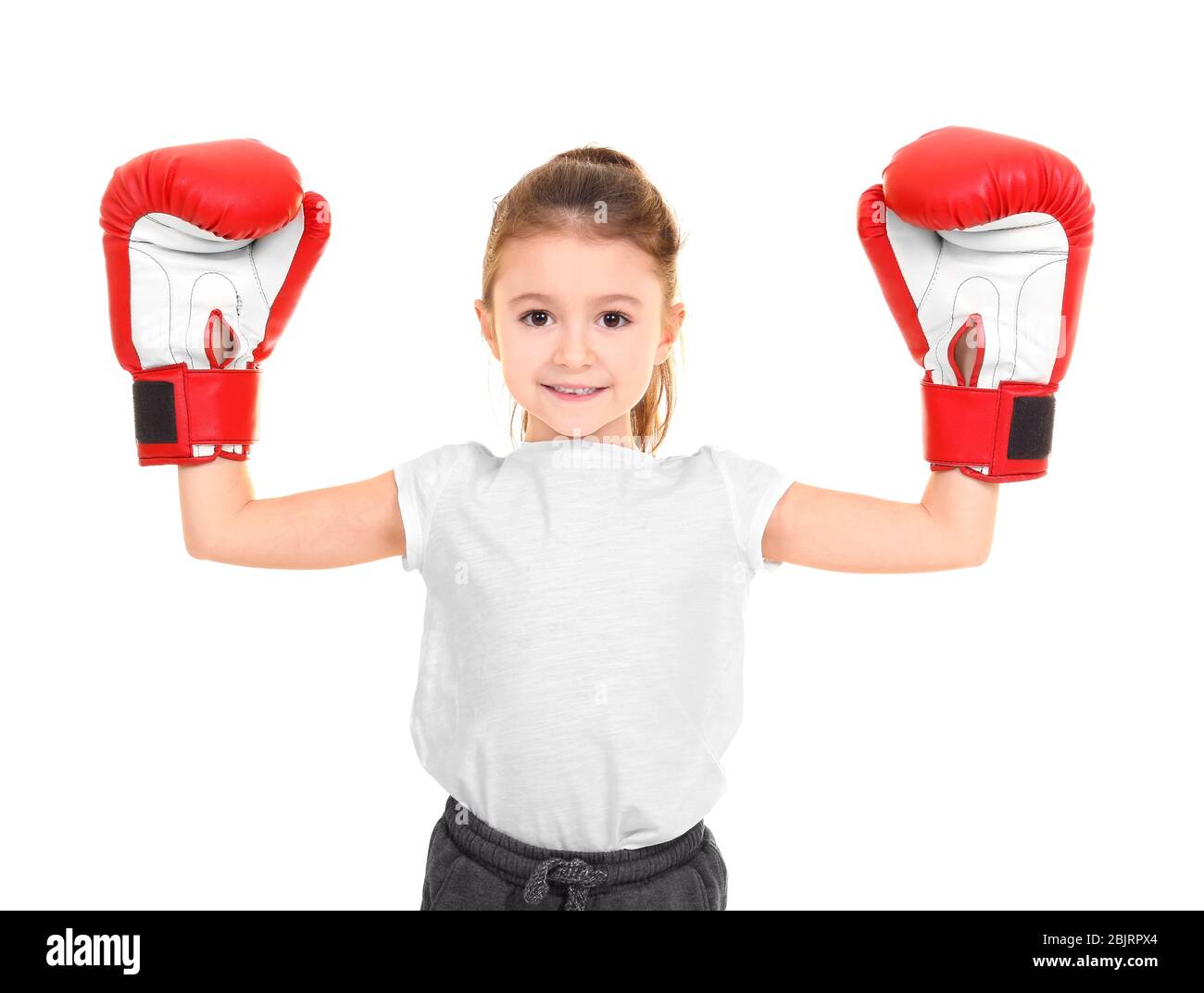 Cute little girl in boxing gloves on white background Stock Photo - Alamy