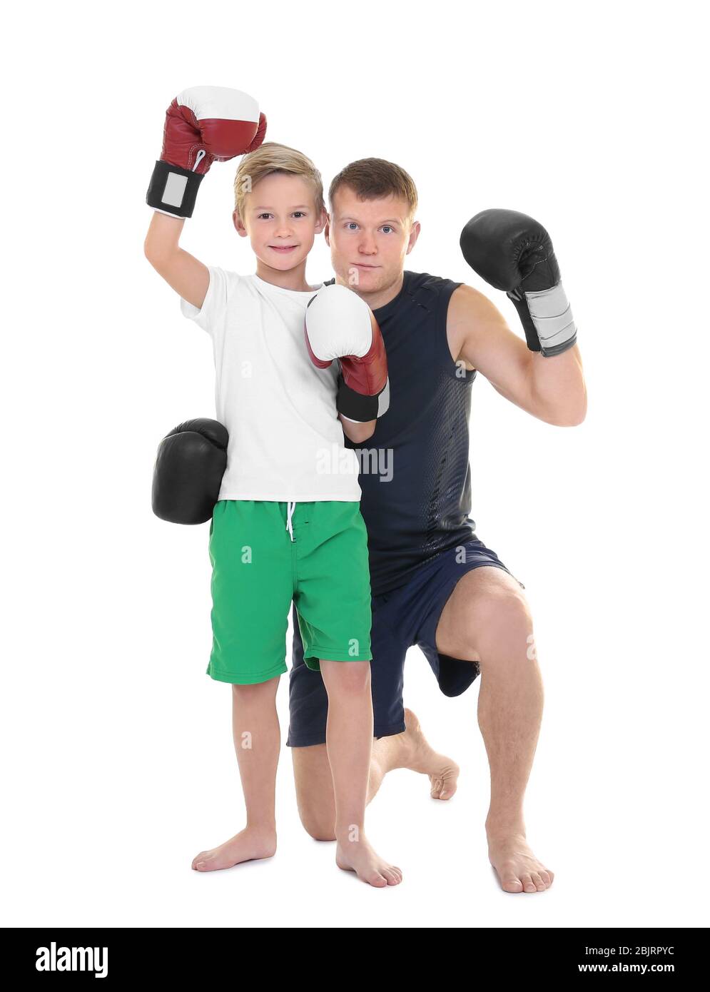 Cute little boy training with boxing coach on white background Stock ...