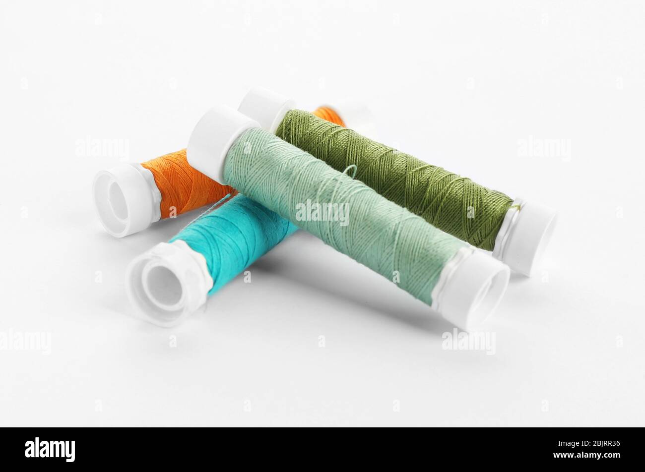 Set of sewing threads on white background Stock Photo - Alamy