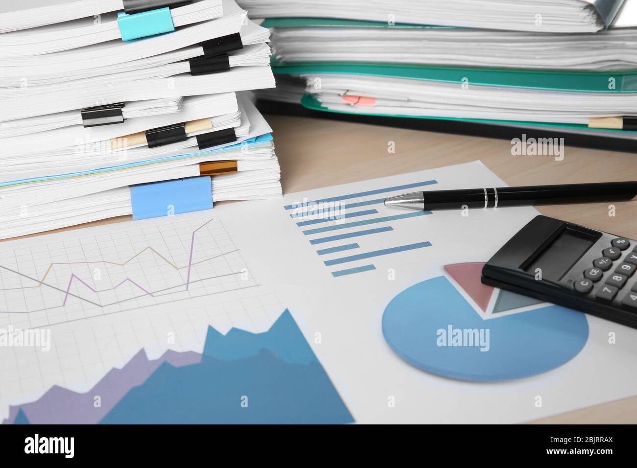 Stacks of documents on table Stock Photo - Alamy