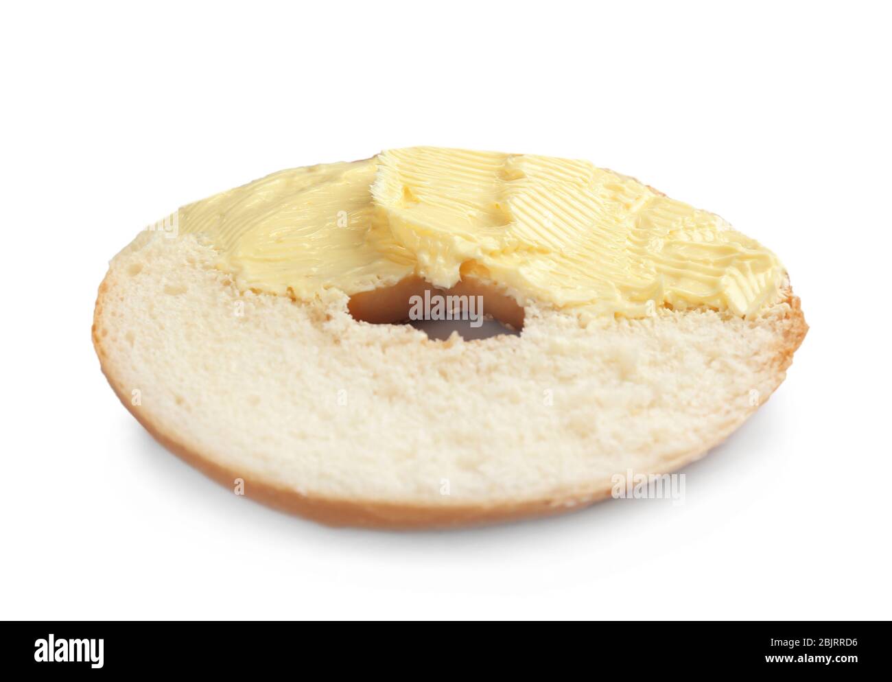 Tasty cut bun with butter on white background Stock Photo - Alamy