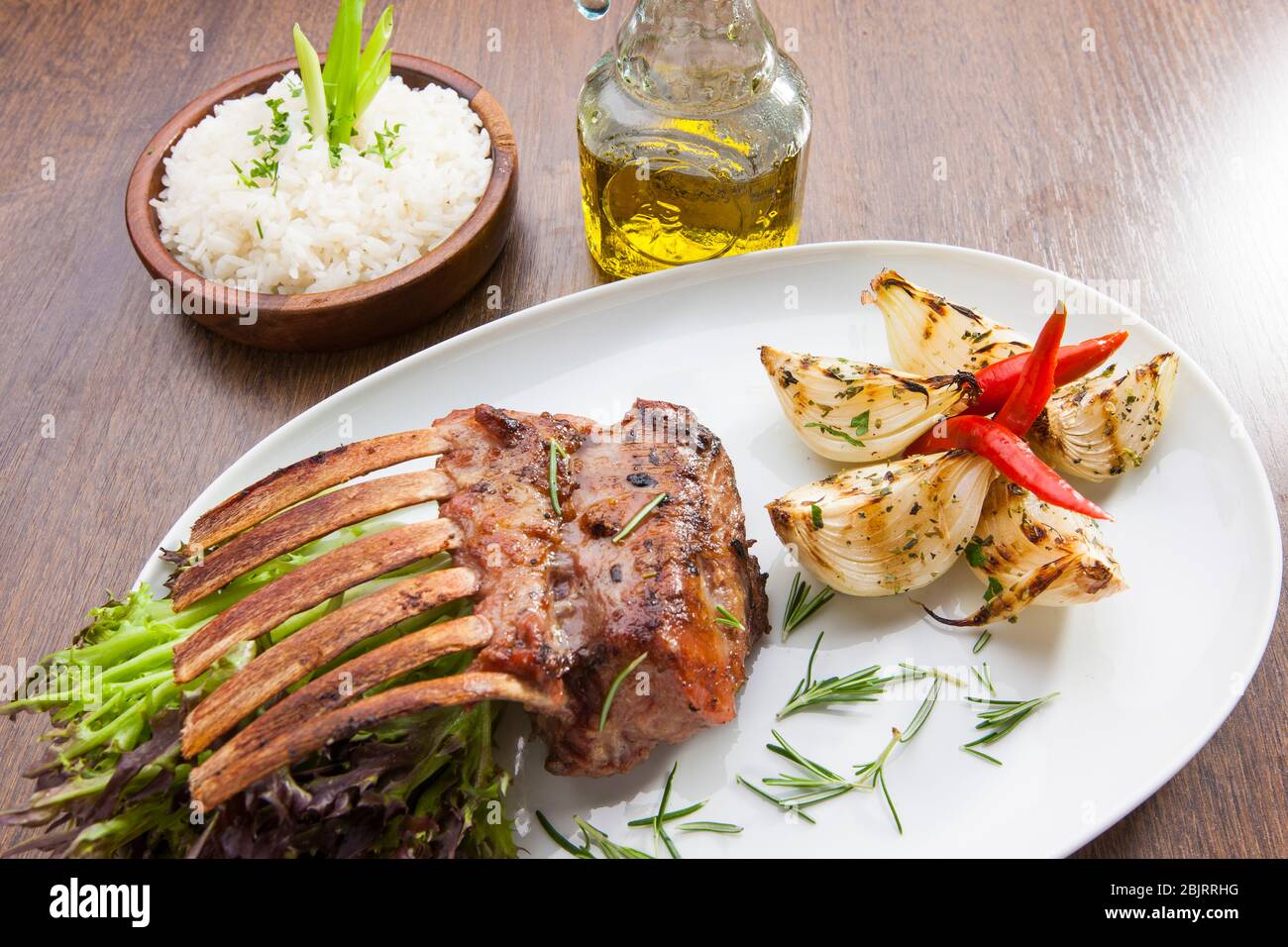 delicious lamb rib barbecue served with side dishes Stock Photo - Alamy
