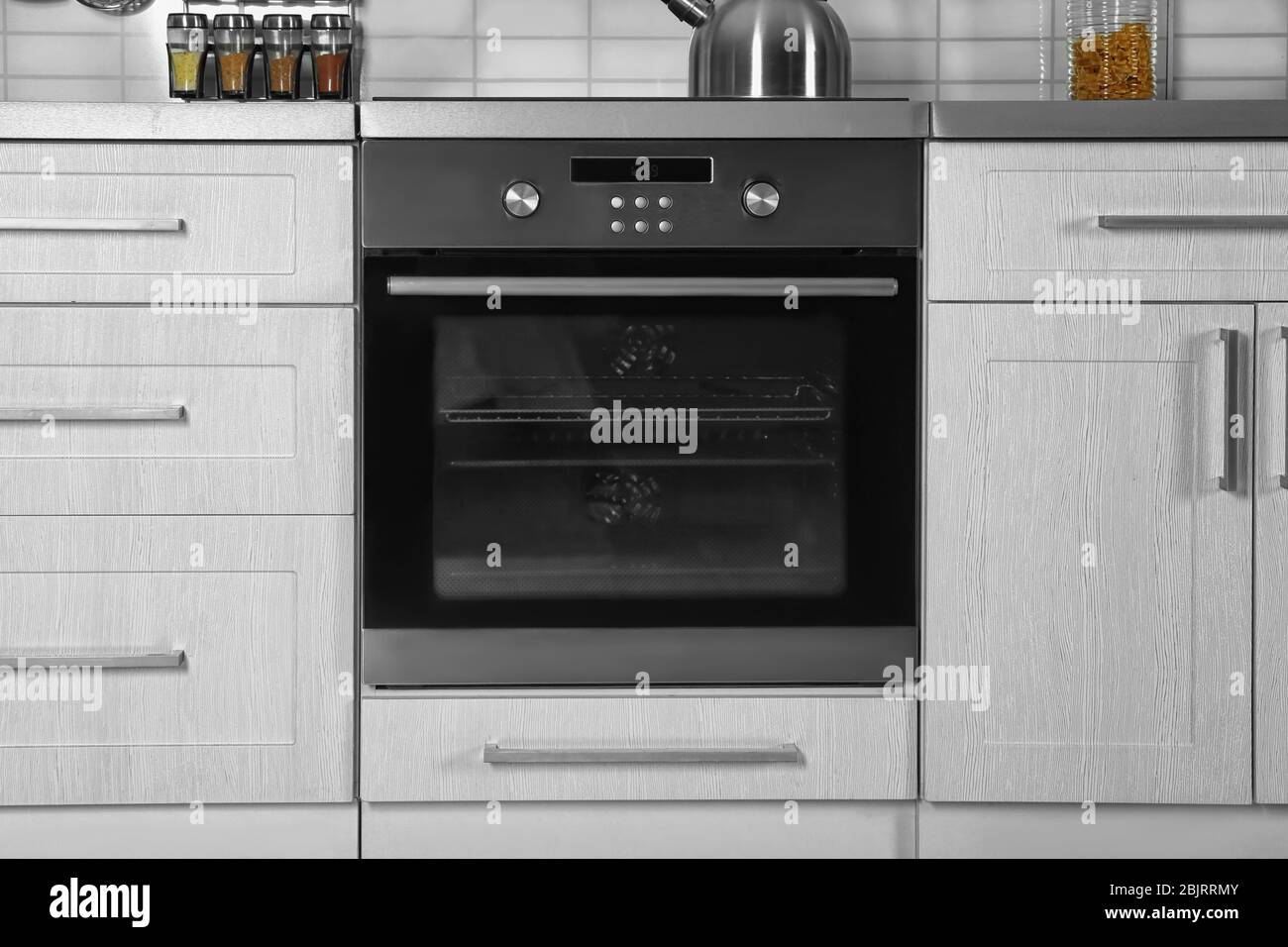 New electric oven in kitchen Stock Photo - Alamy