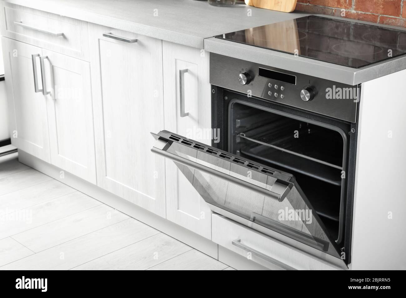 New electric oven in kitchen Stock Photo - Alamy