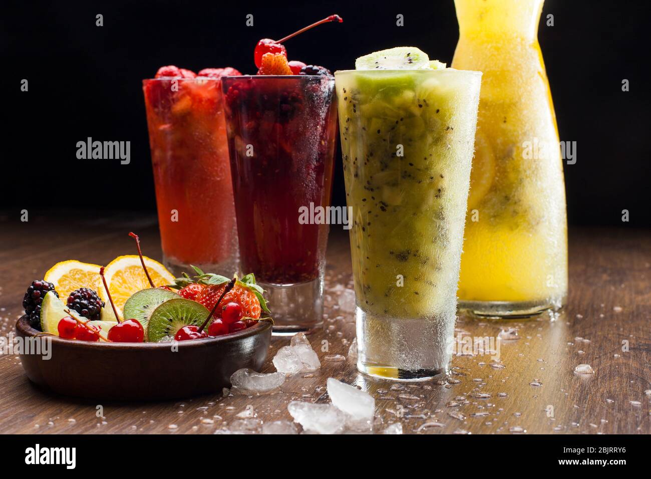delicious cold drinks of colorful tropical fruits, strawberry, kiwi ...
