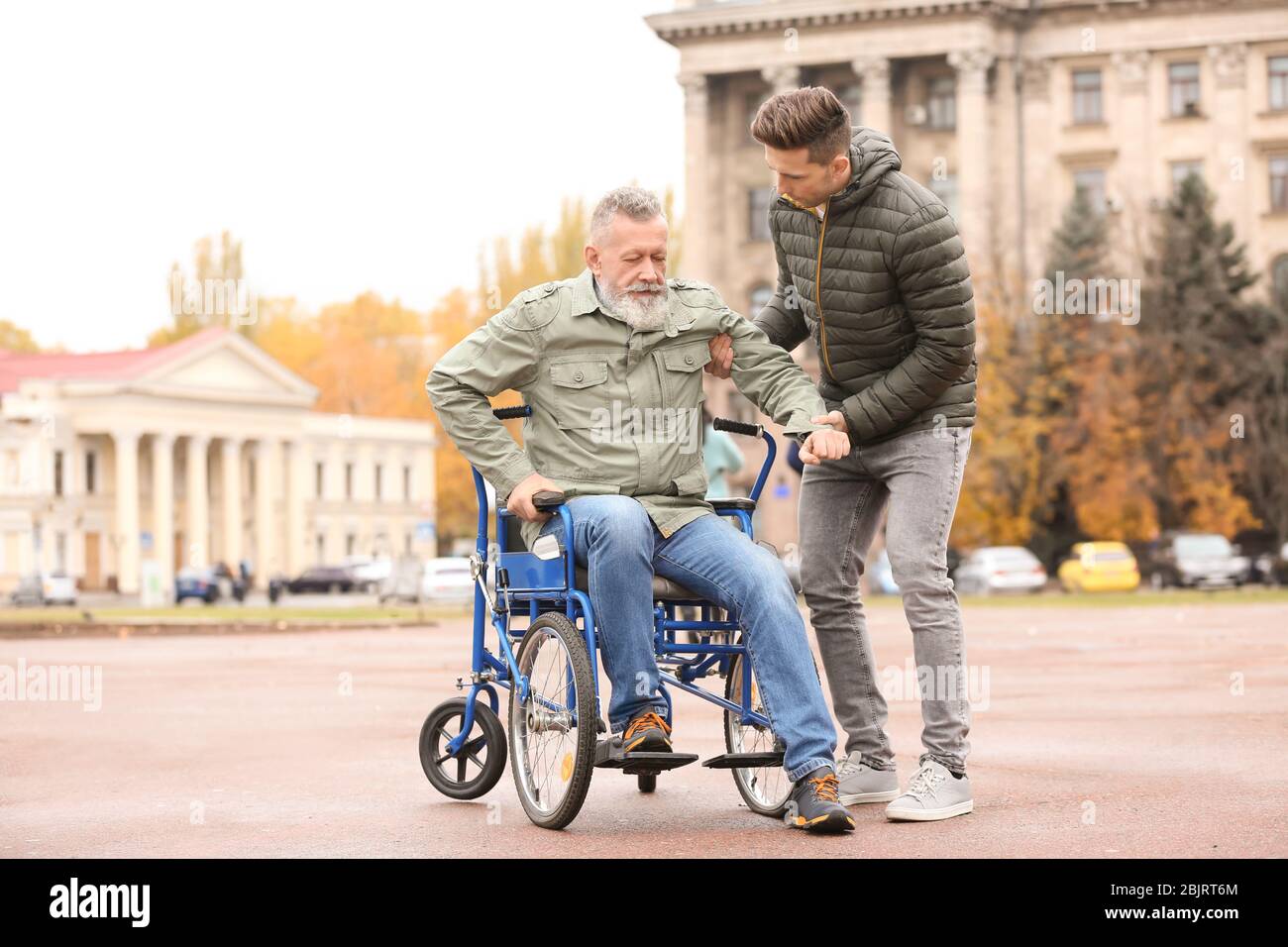 Elderly father son wheelchair outdoors hi-res stock photography and ...