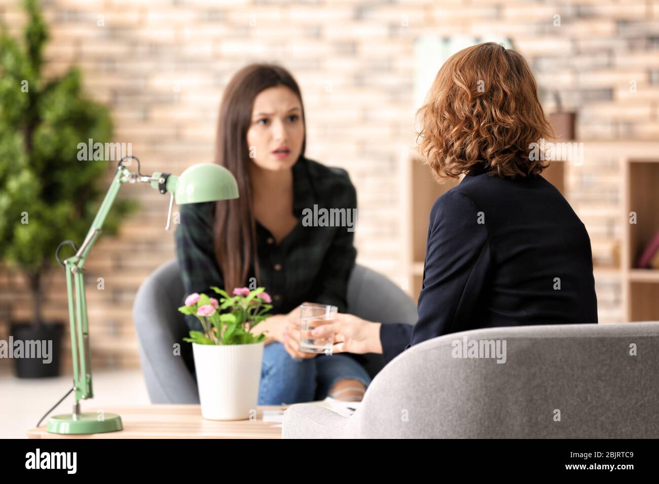 Female psychologist working with patient in office Stock Photo - Alamy