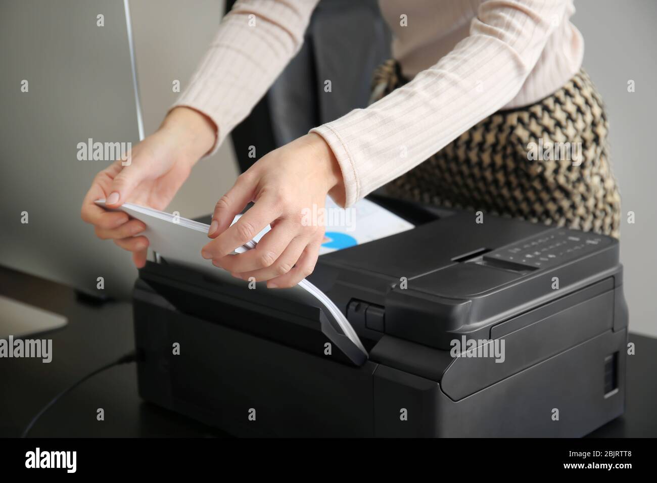 Woman with paper files in office hi-res stock photography and images ...