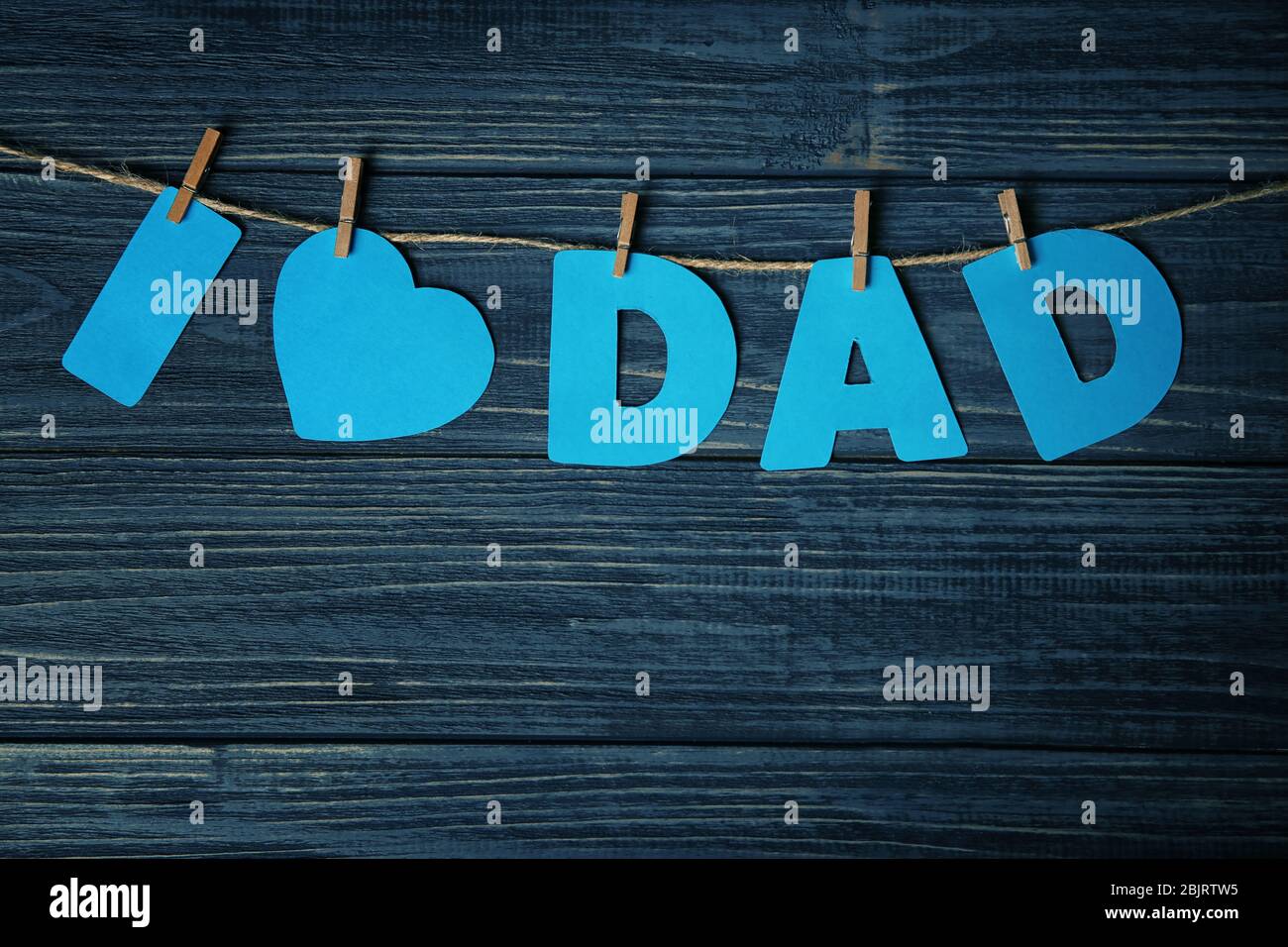 Phrase "I love dad" made of paper letters as greeting for Father's day ...
