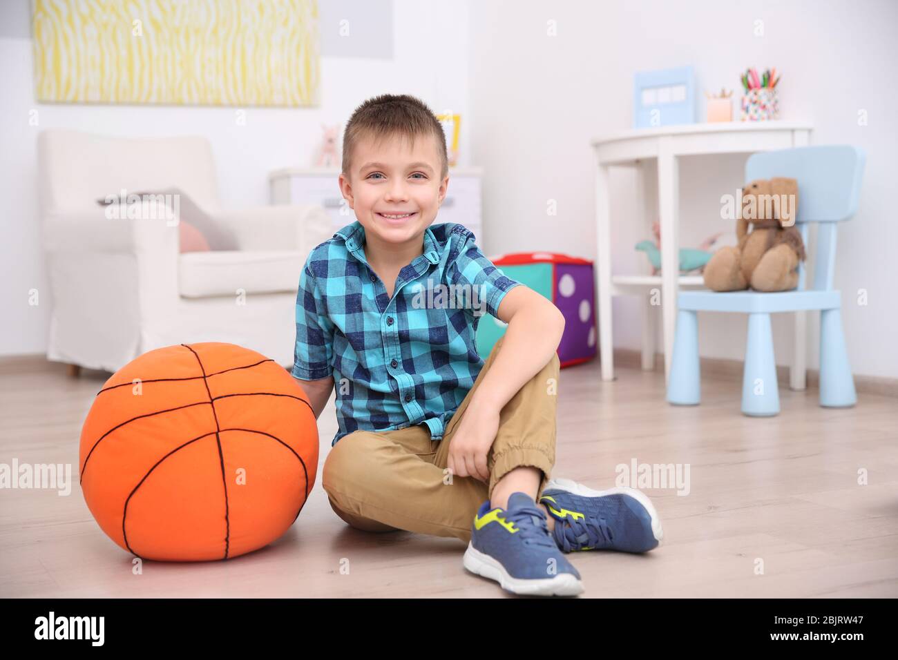 Cute little boy with soft toy at home Stock Photo - Alamy