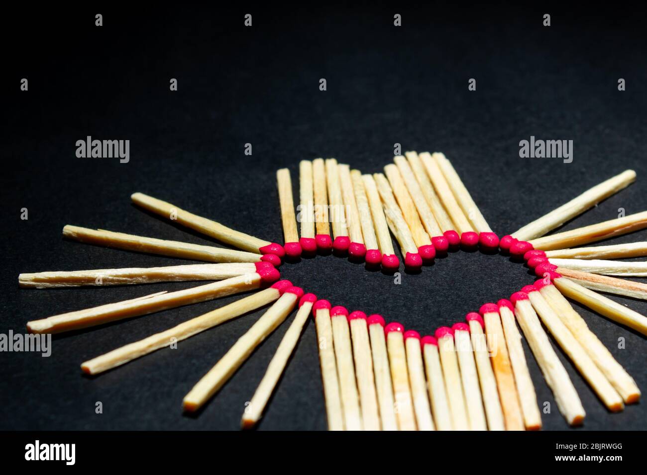 match heart on a dark background close up. copy space Stock Photo - Alamy