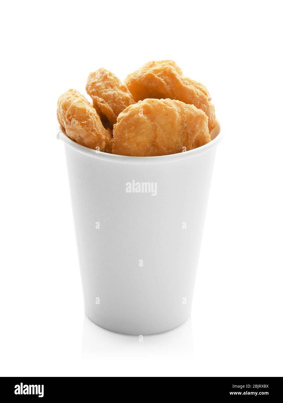 Paper cup with tasty chicken nuggets on white background Stock Photo ...