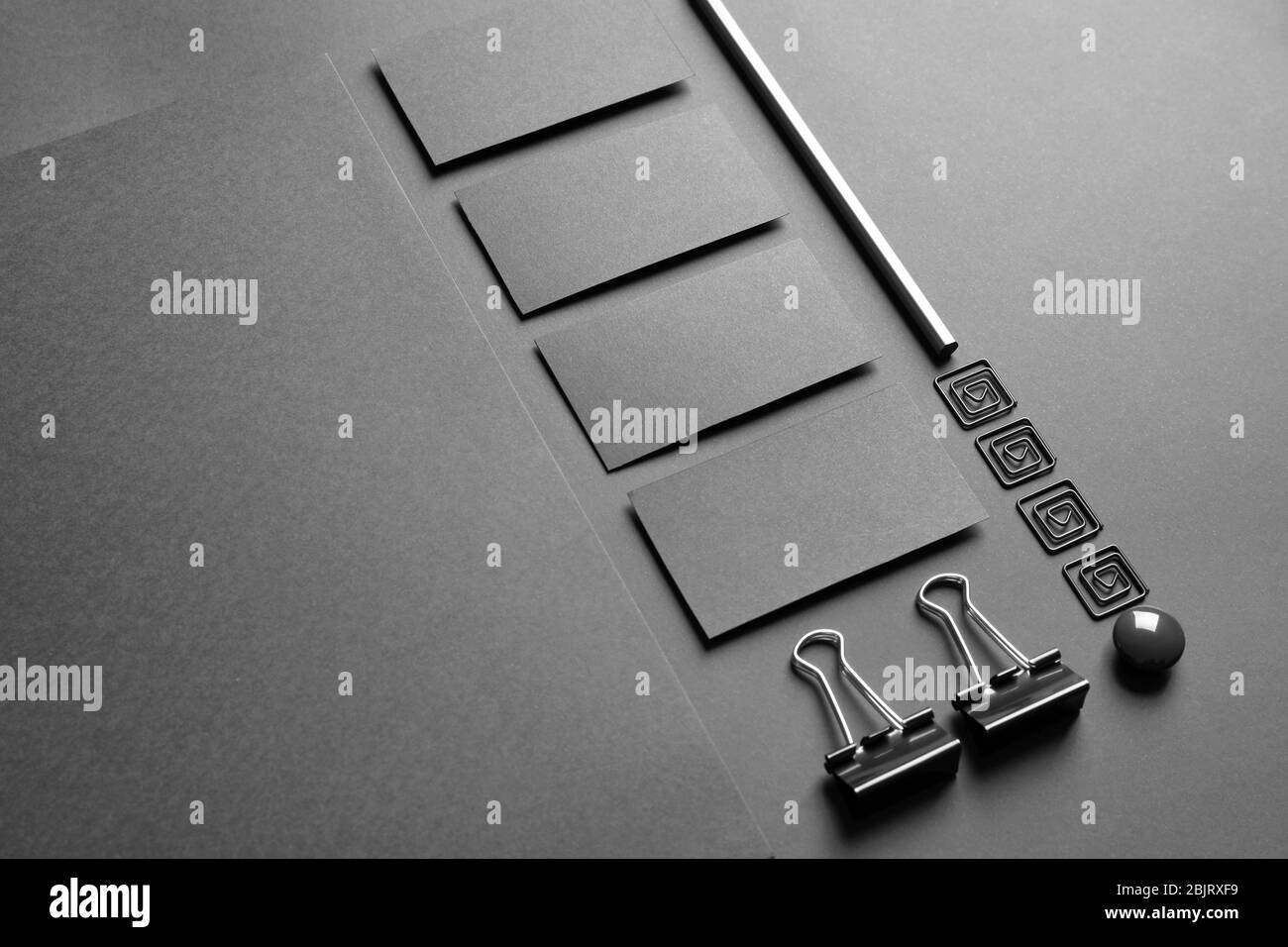 Blank items as mockups for branding on dark background Stock Photo - Alamy