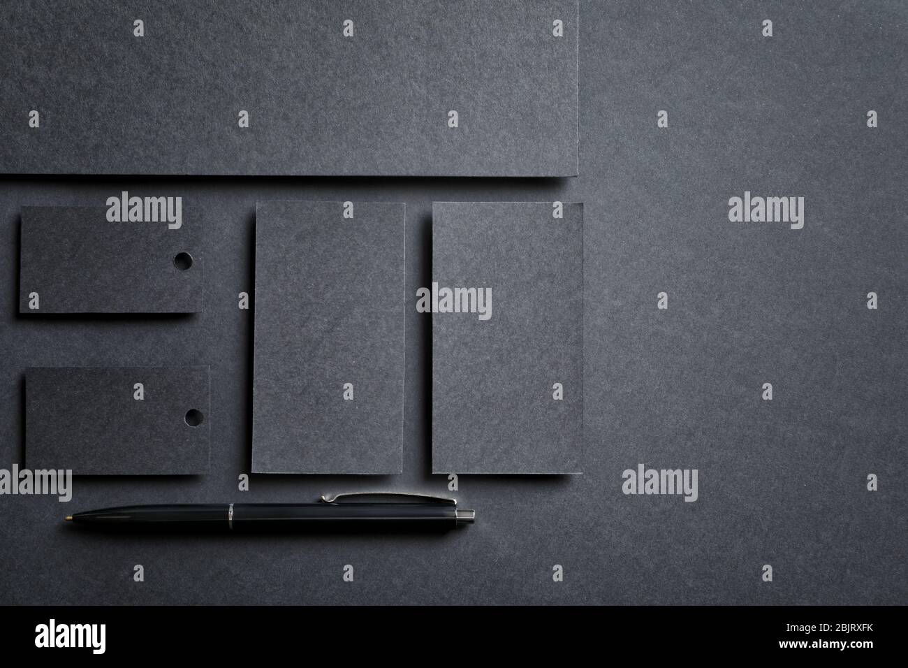 Blank items as mockups for branding on dark background Stock Photo - Alamy