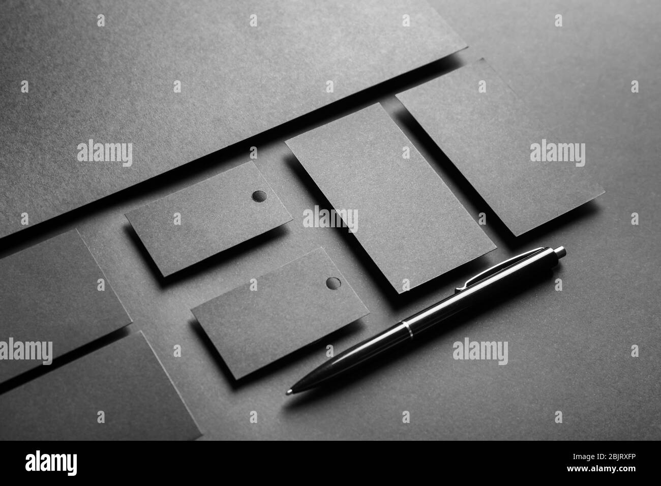 Blank items as mockups for branding on dark background Stock Photo - Alamy