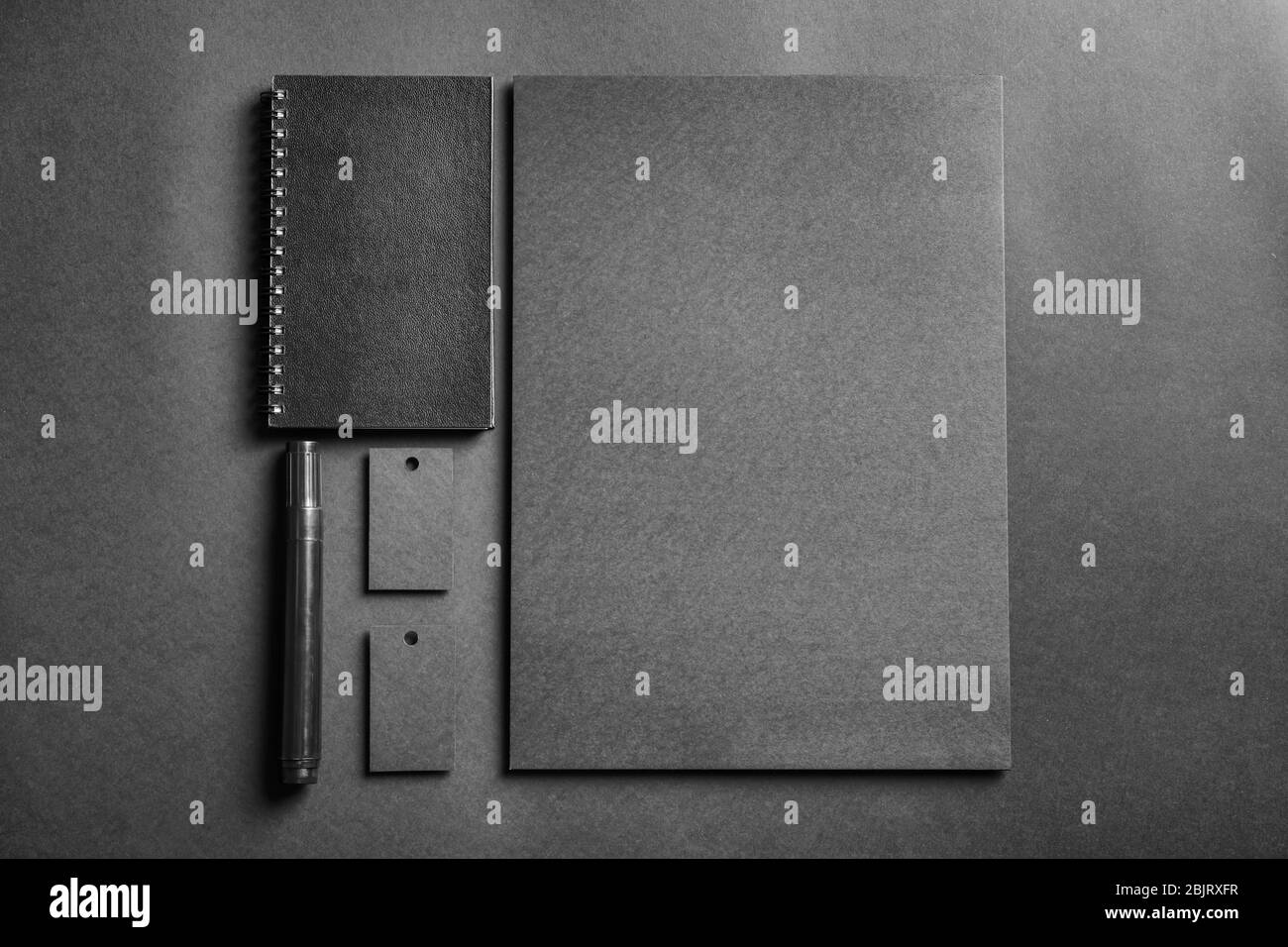 Blank items as mockups for branding on dark background Stock Photo - Alamy