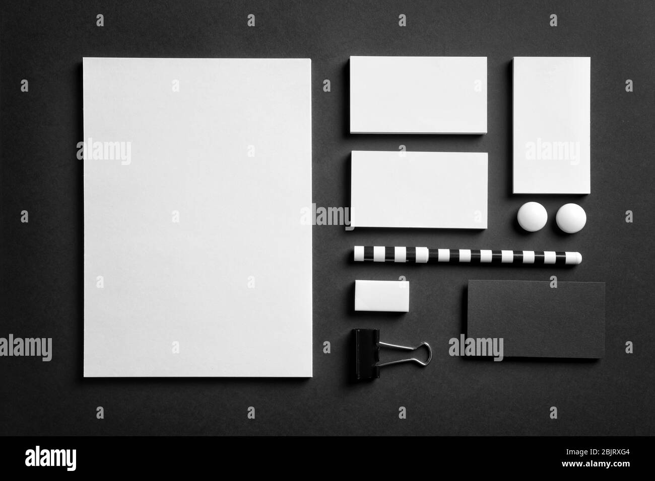 Blank items as mockups for branding on dark background Stock Photo - Alamy