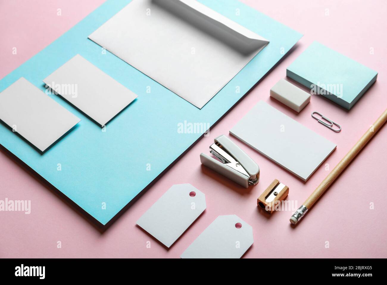 Blank items as mockups for branding on color background Stock Photo - Alamy