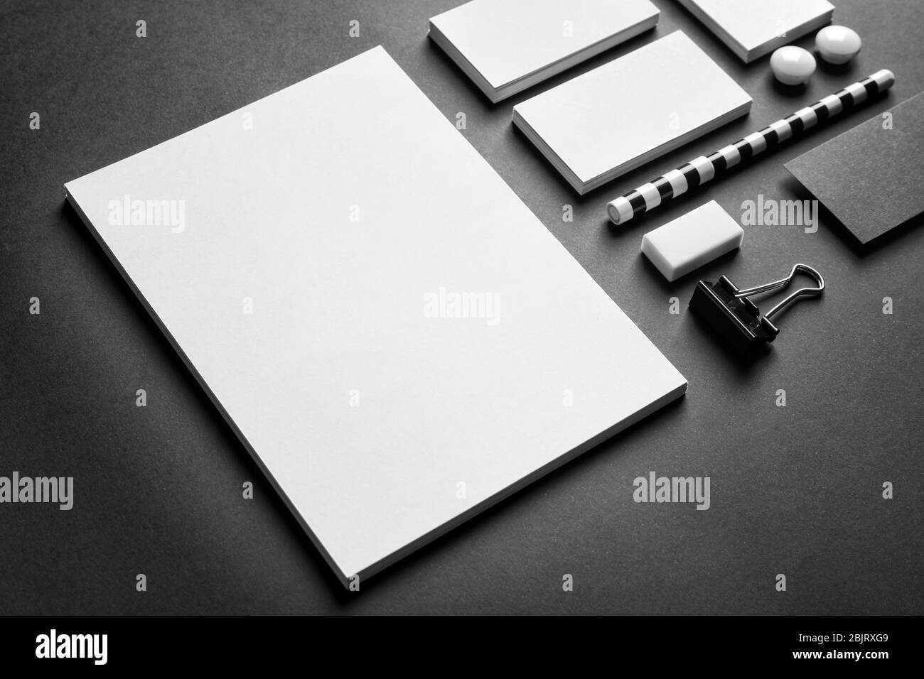 Blank items as mockups for branding on dark background Stock Photo - Alamy