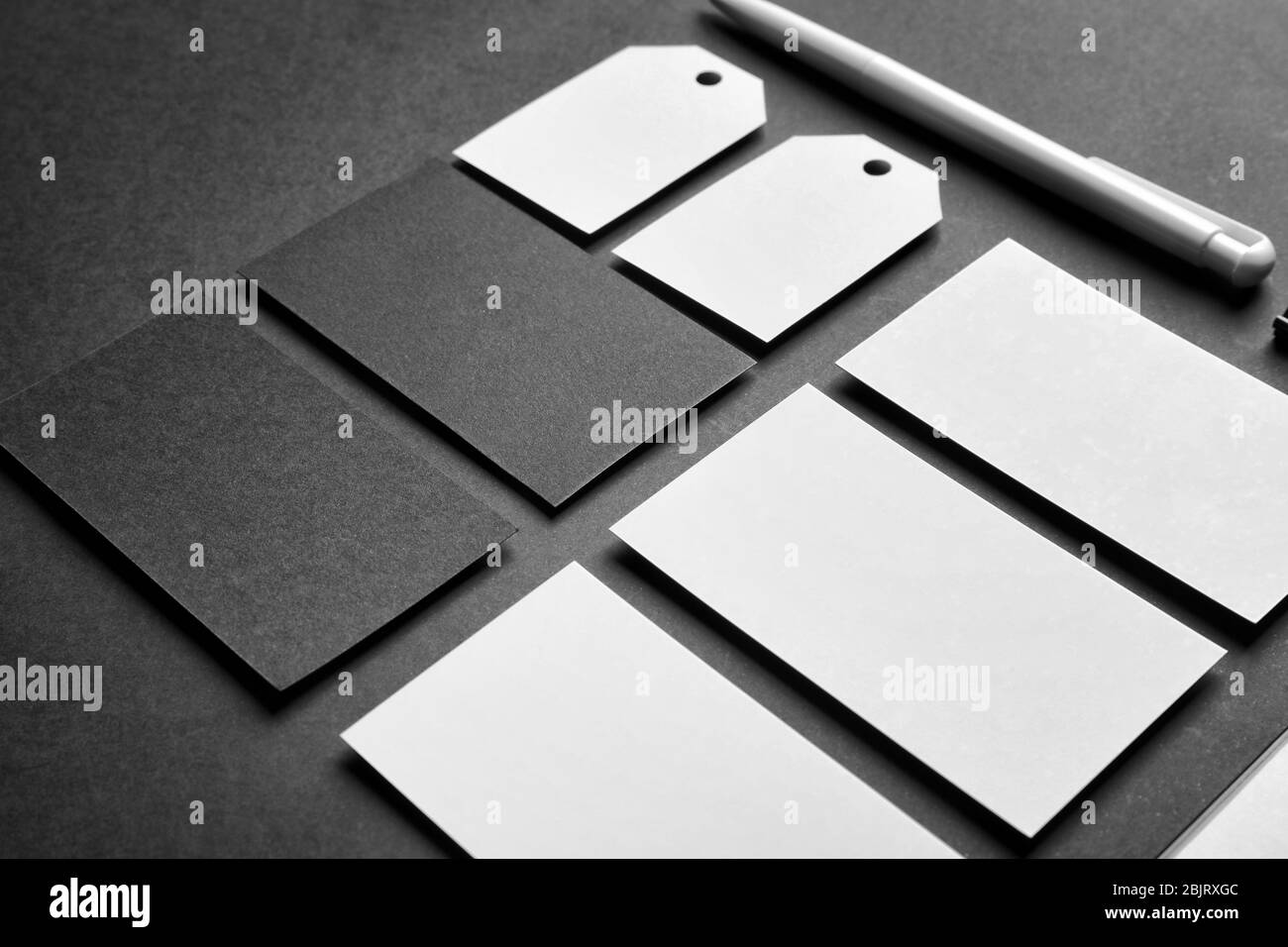 Blank items as mockups for branding on dark background Stock Photo - Alamy