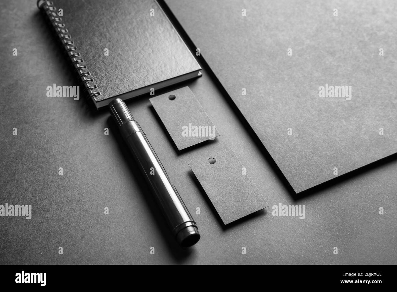 Blank items as mockups for branding on dark background Stock Photo - Alamy