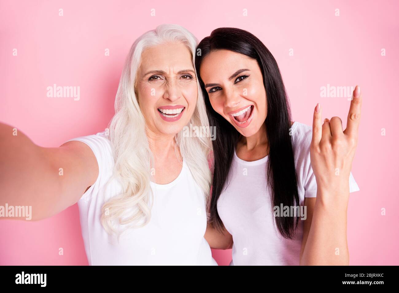 Closeup Photo Of Cheerful Aged Mother Young Daughter Making Selfies