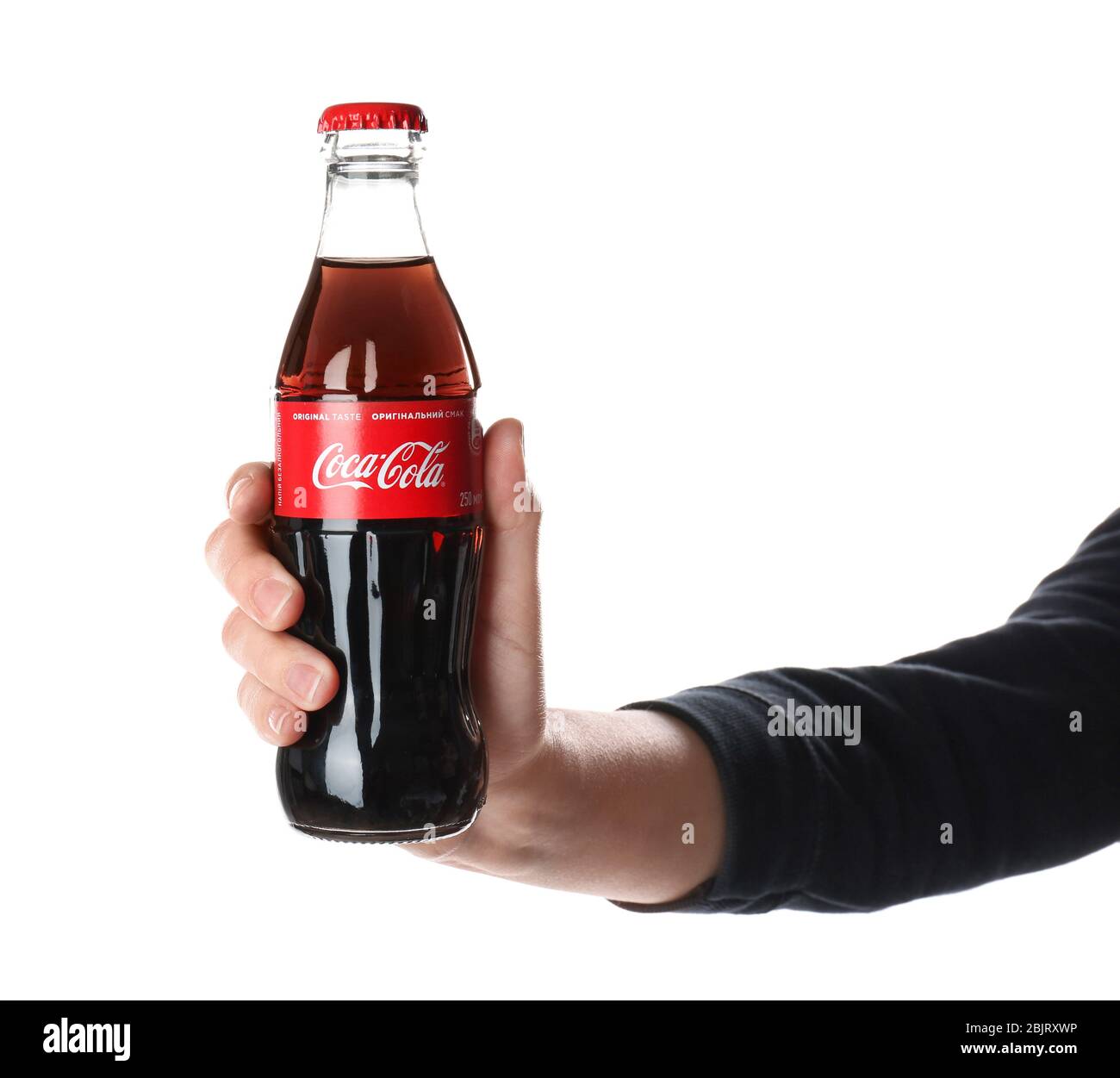 Hand holding coca cola bottle hi-res stock photography and images - Alamy