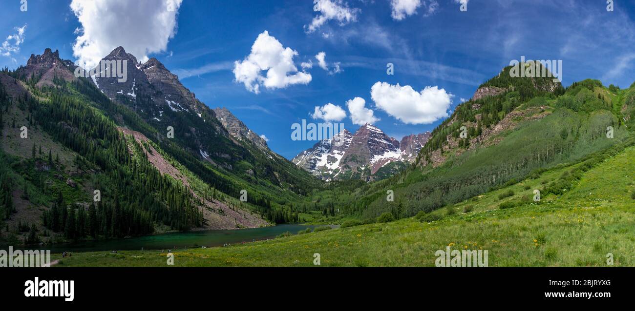 Majestic Maroon Bells peaks and Maroon Lake on a sunny day and blue sky ...