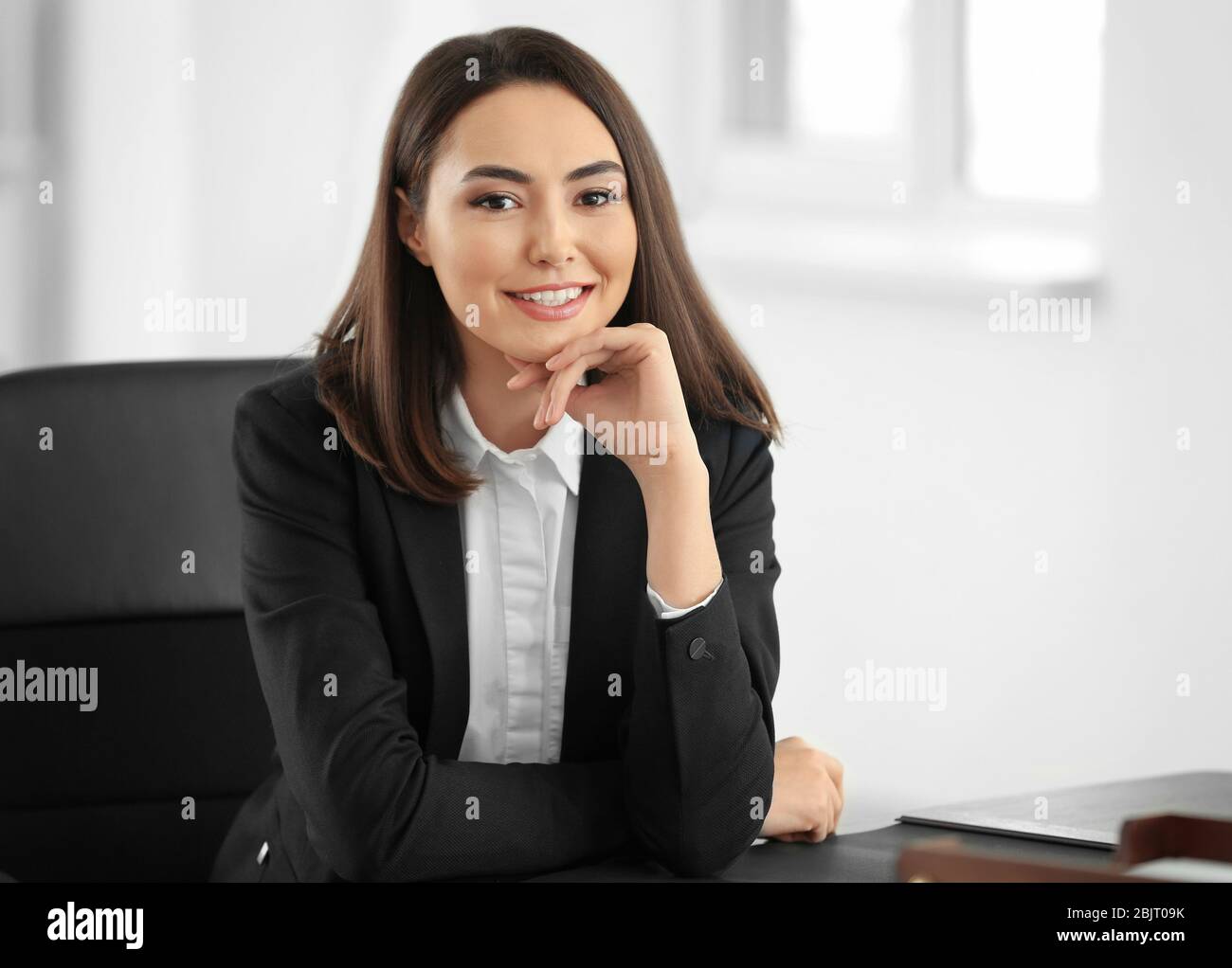 Attractive young lawyer in office Stock Photo - Alamy
