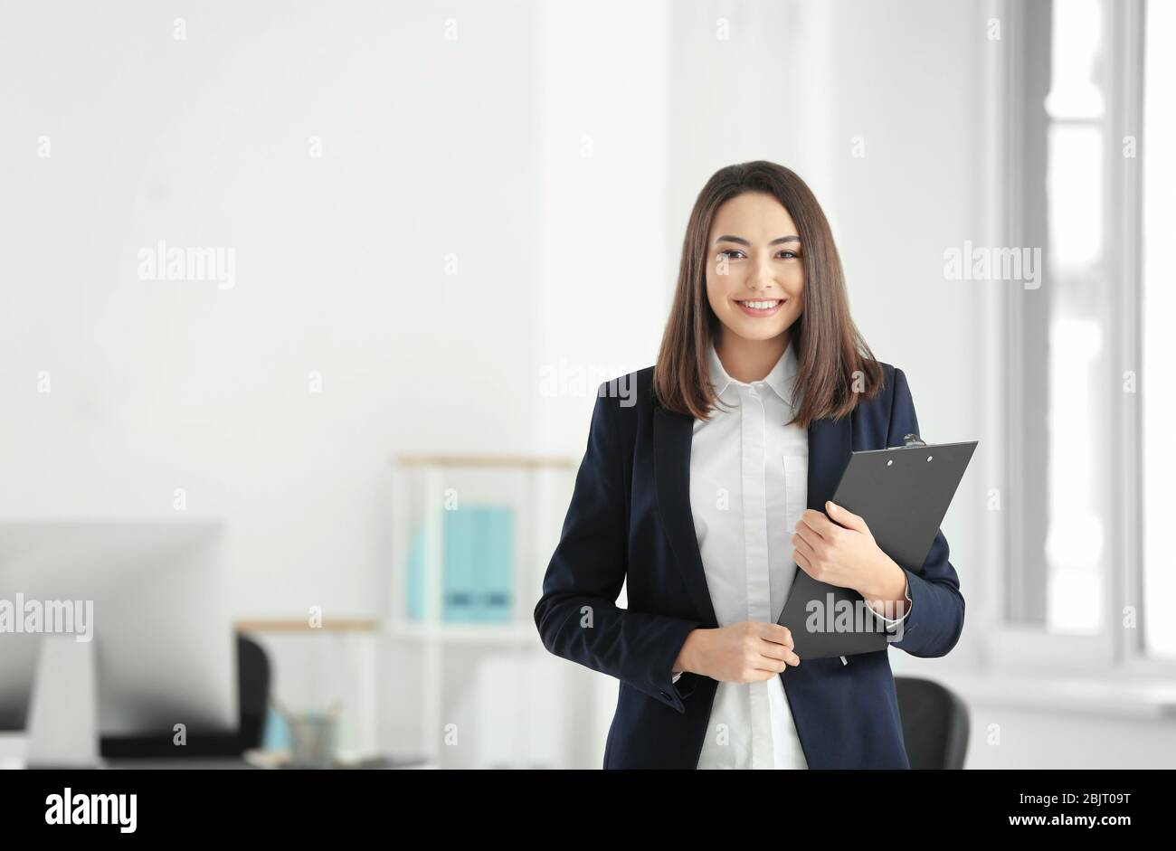 Attractive young lawyer in office Stock Photo - Alamy