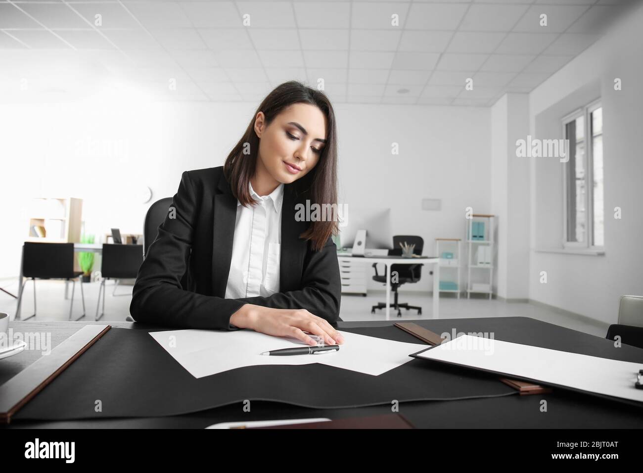 Attractive young lawyer in office Stock Photo - Alamy