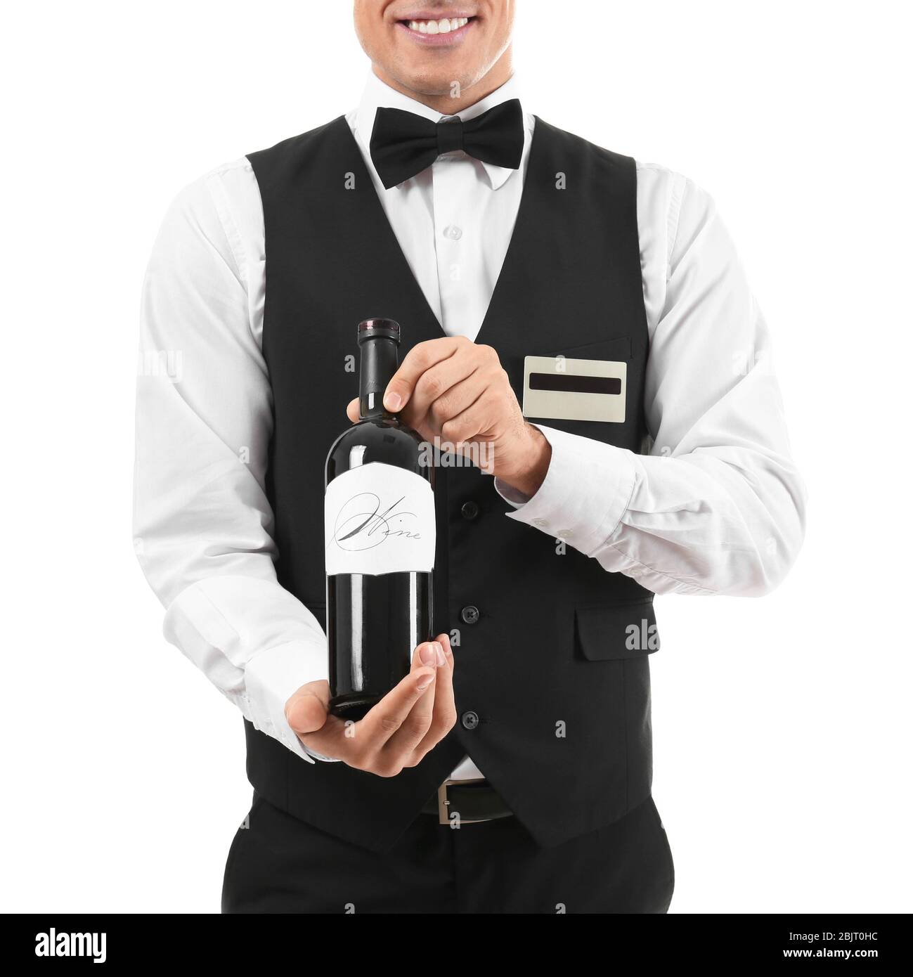 Waiter holding bottle of wine on white background Stock Photo - Alamy