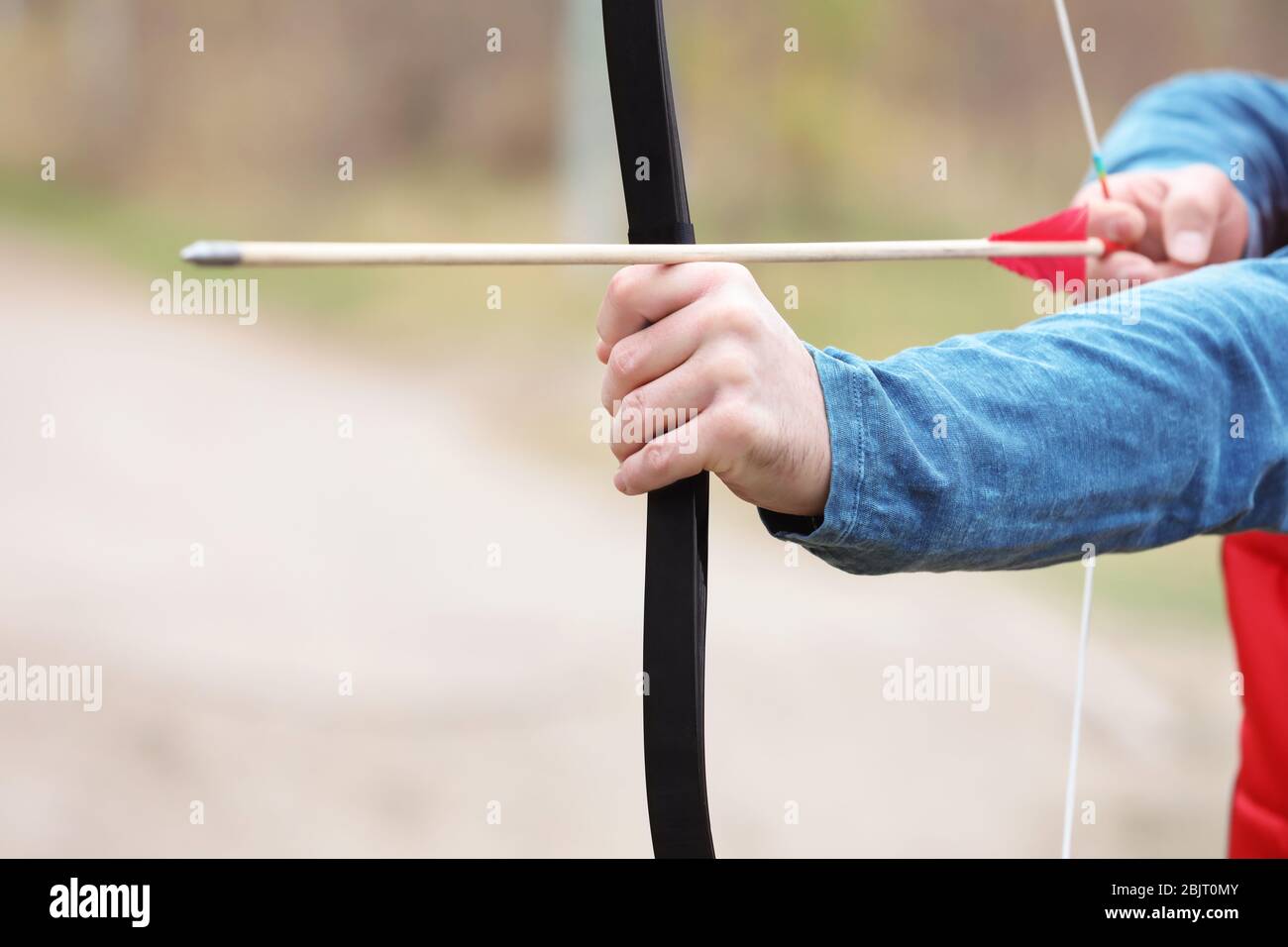 Archery bow hands hi-res stock photography and images - Alamy