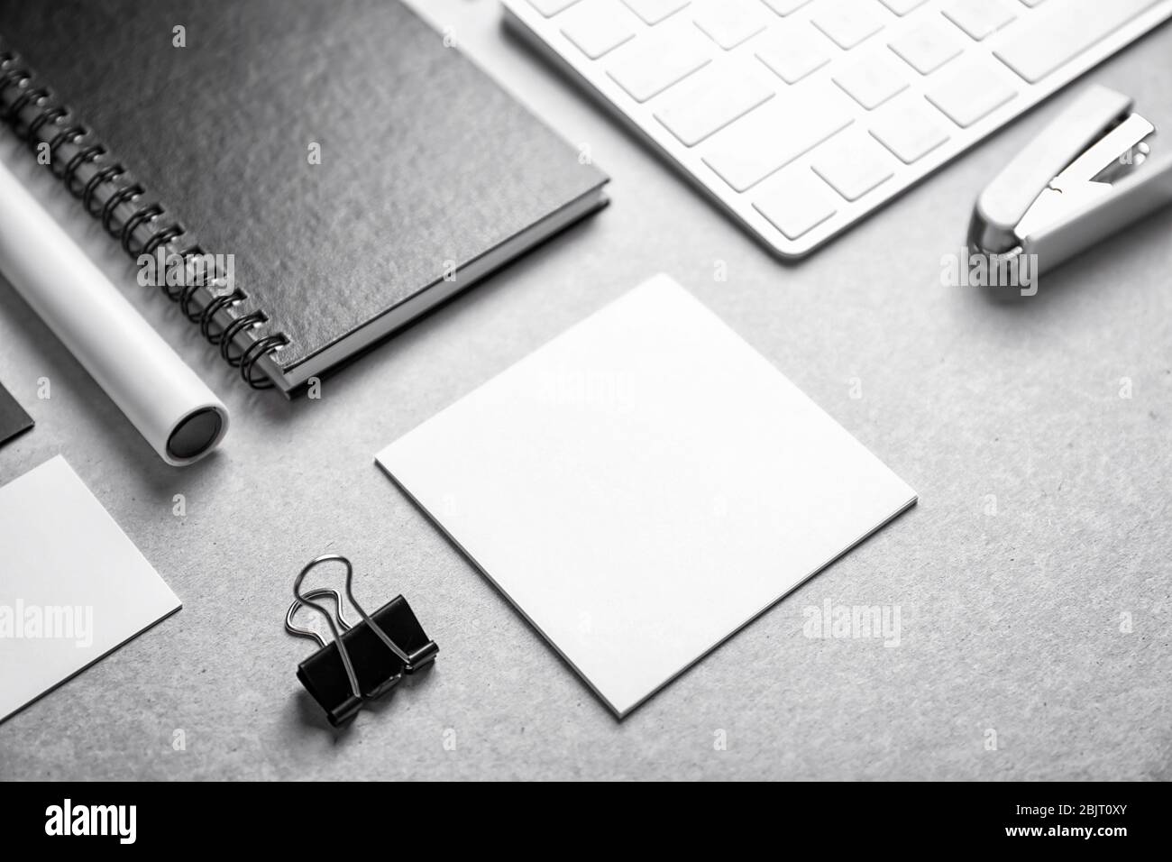 Blank items as mockups for branding on grey background Stock Photo - Alamy