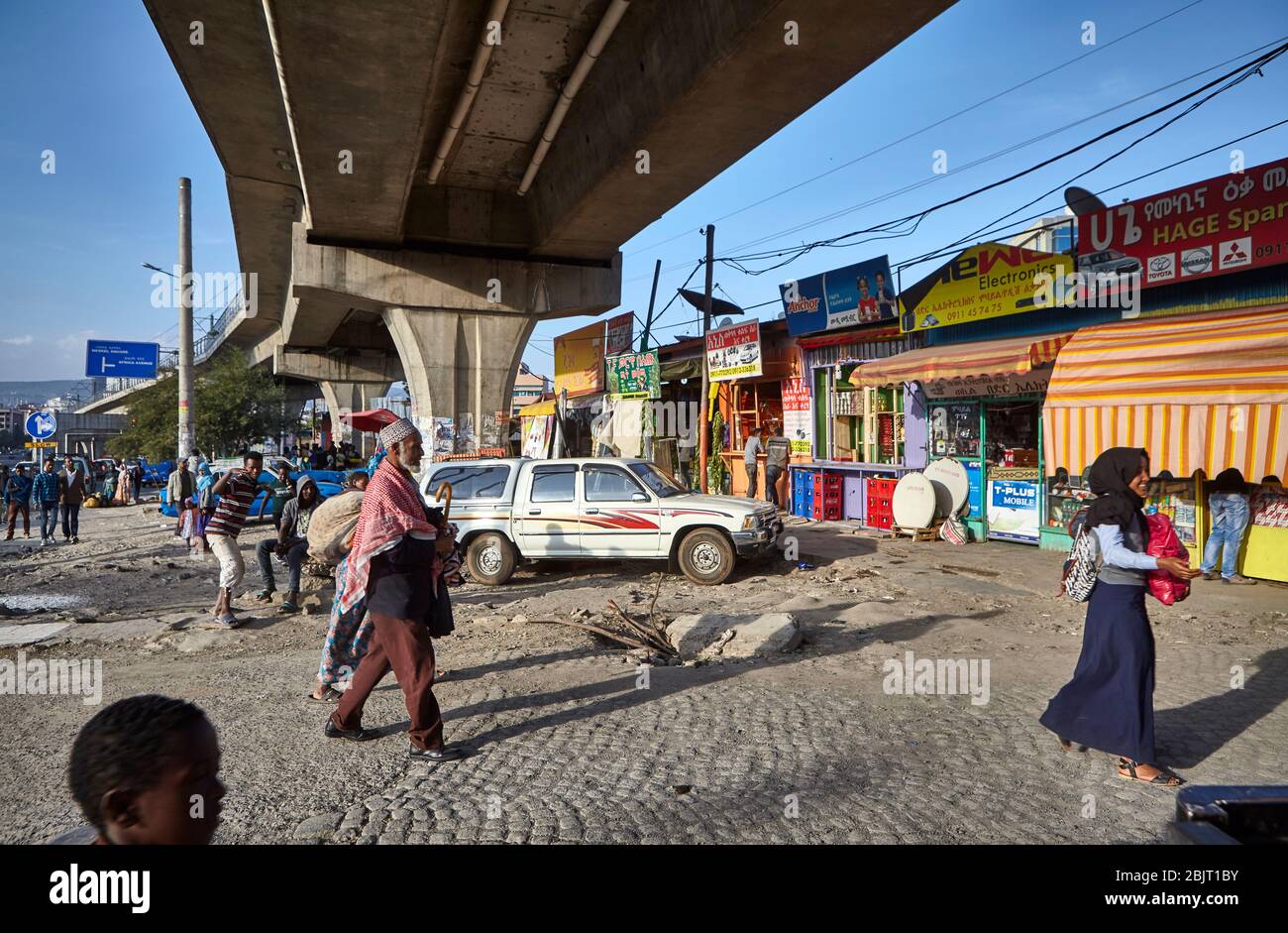 A new constructed expressway on a viaduct crosses little colourful ...