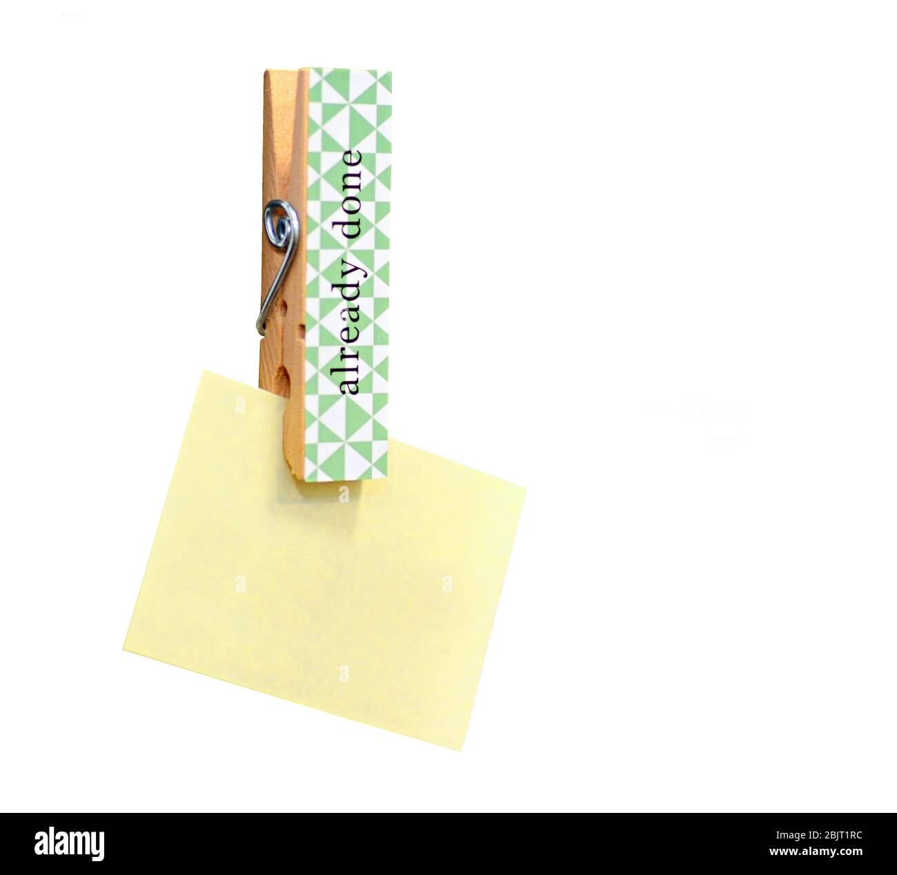 Yellow stick note paper pinned on wooden peg isolated on white ...