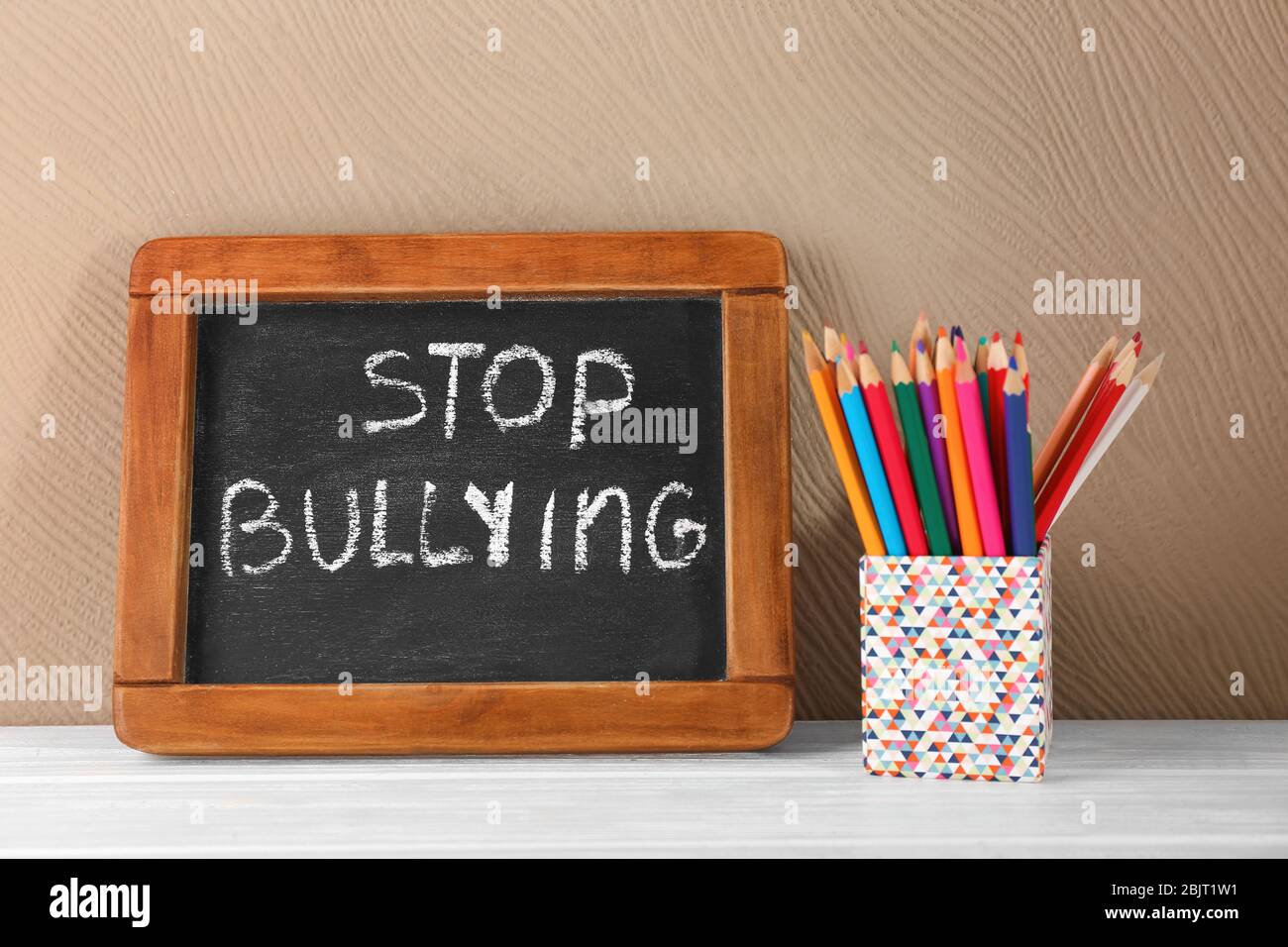 Chalkboard with text "Stop bullying" on table Stock Photo - Alamy