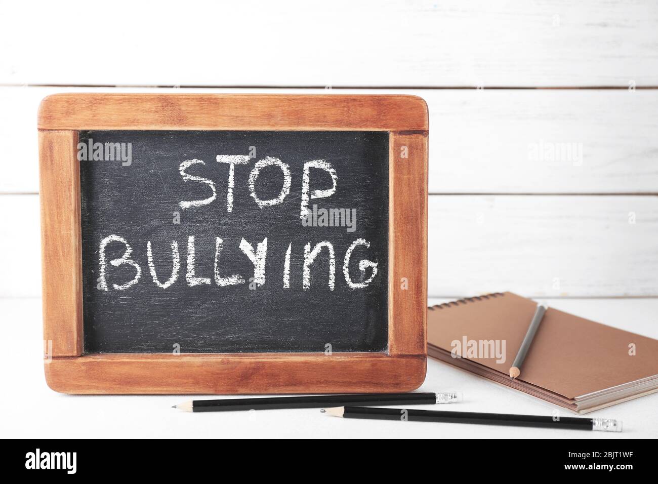 Chalkboard with text "Stop bullying" on table Stock Photo - Alamy